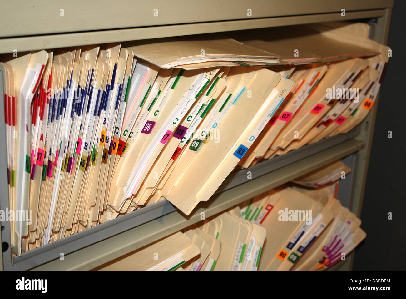 A collection of file folders arranged neatly. The folders are used for document storage and ...