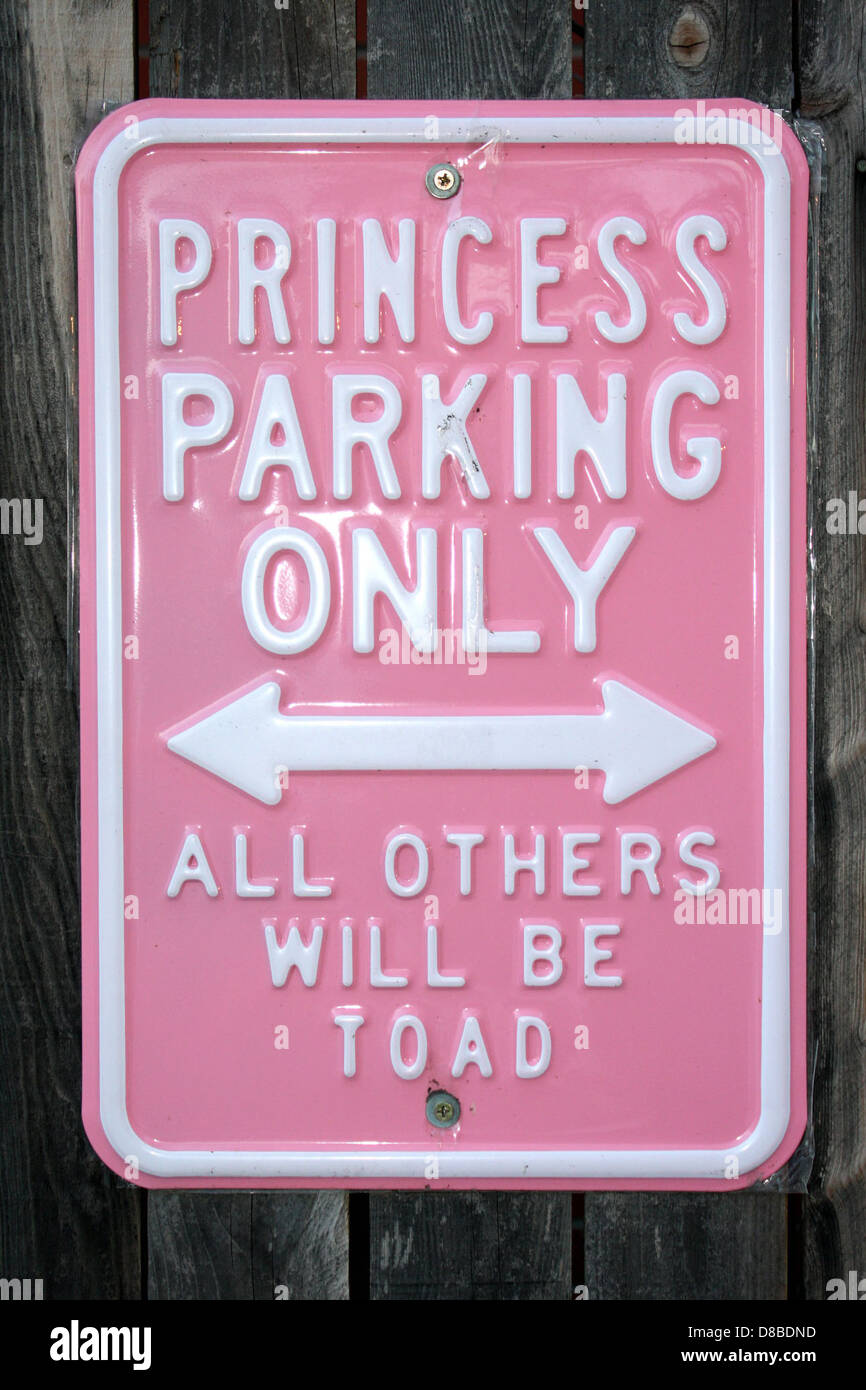 A humorous parking sign featuring playful or witty messaging. The sign ...