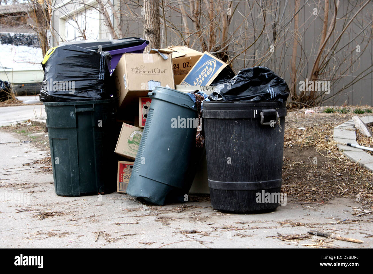 garbage cans overflowing Stock Photo - Alamy