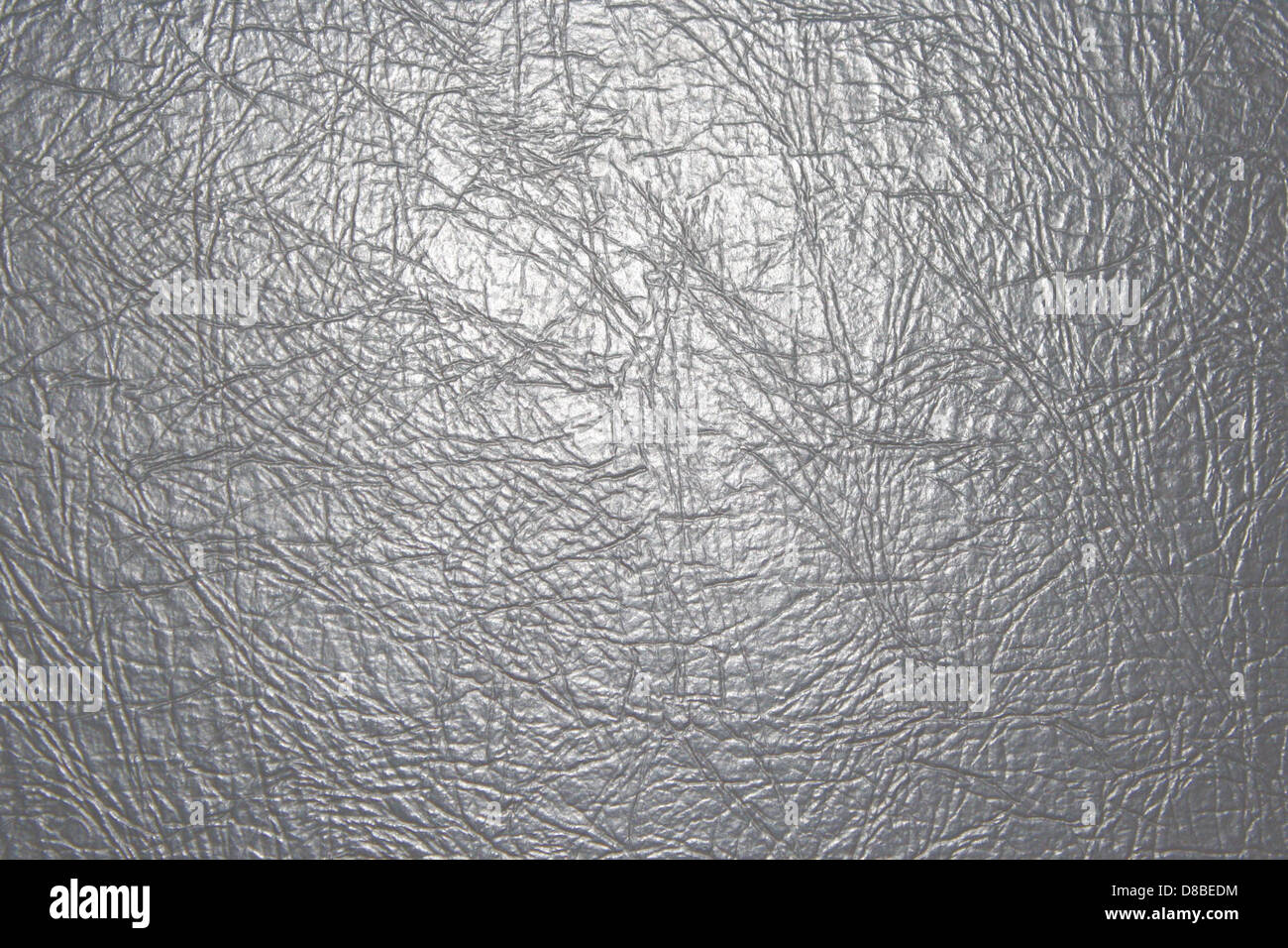 This image shows a close-up of gray leather, highlighting its smooth ...