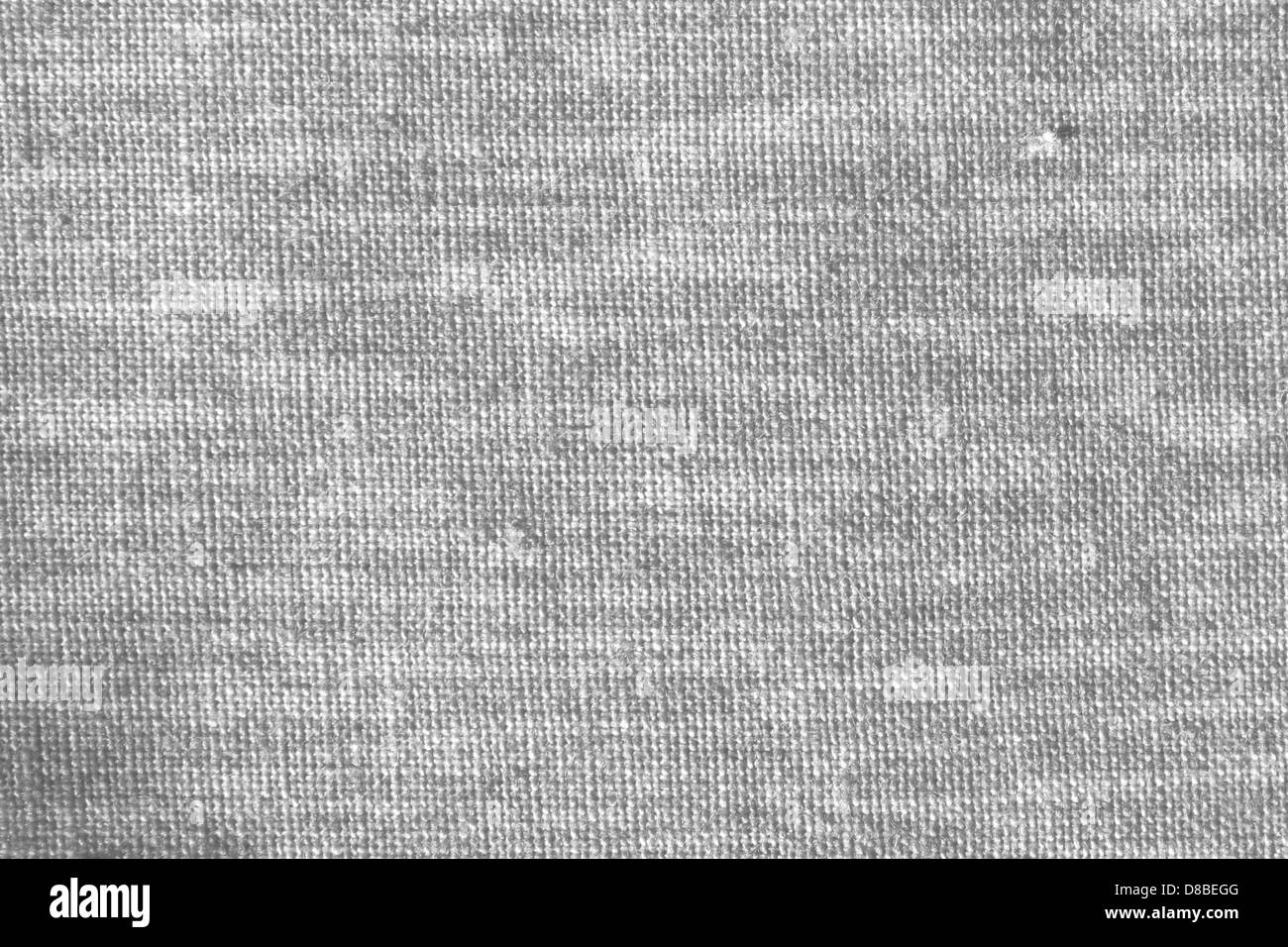 A close-up view of gray woven fabric highlights its intricate texture ...