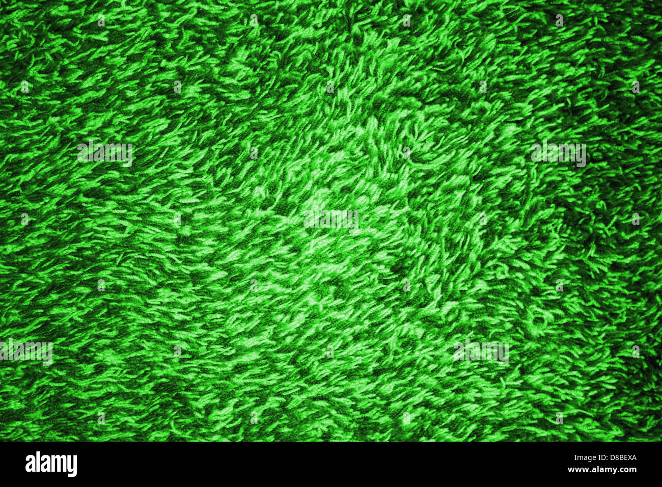 A close-up of green shag carpeting, showcasing the soft, thick fibers ...