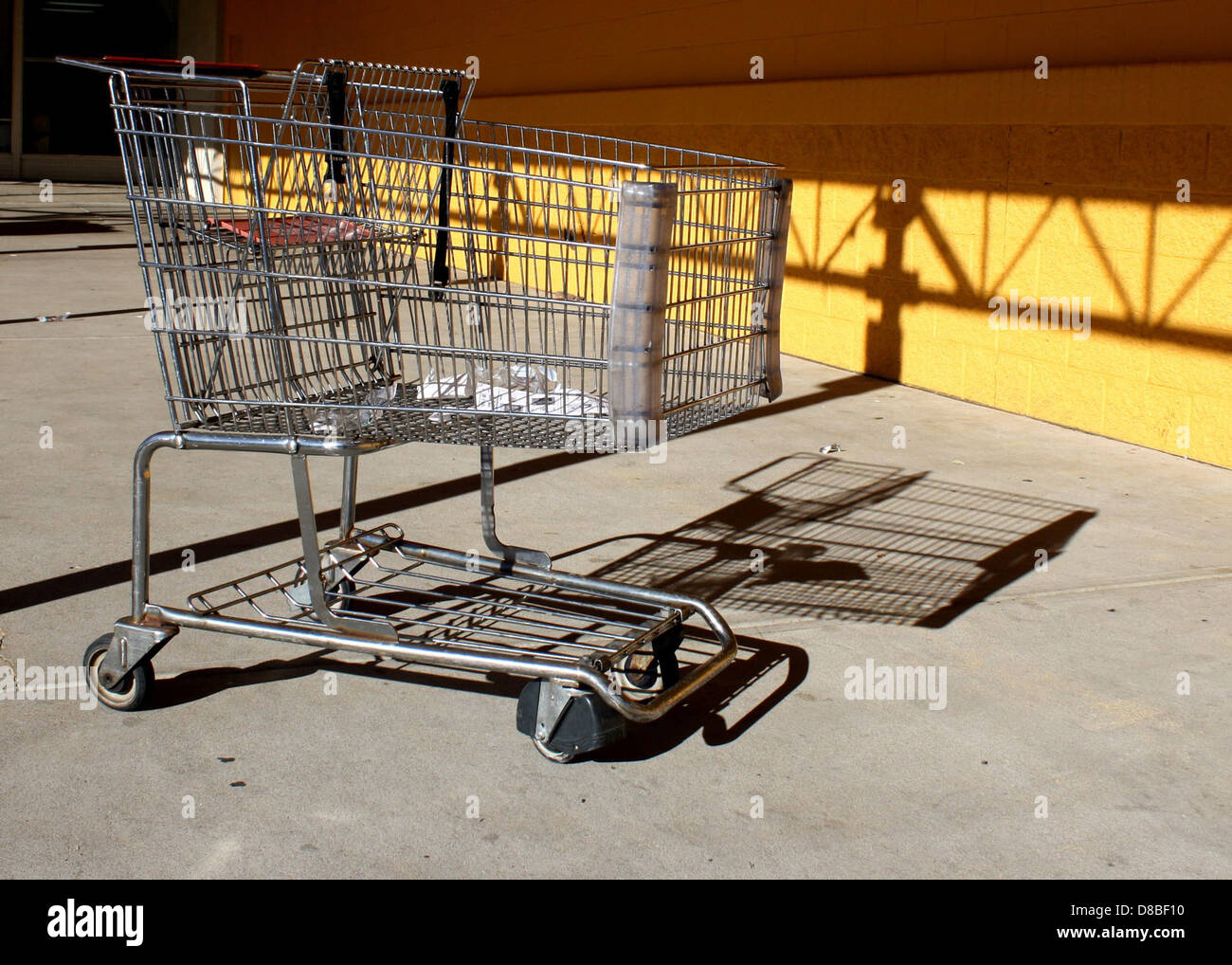 A typical grocery cart filled with various items is shown. The cart is ...