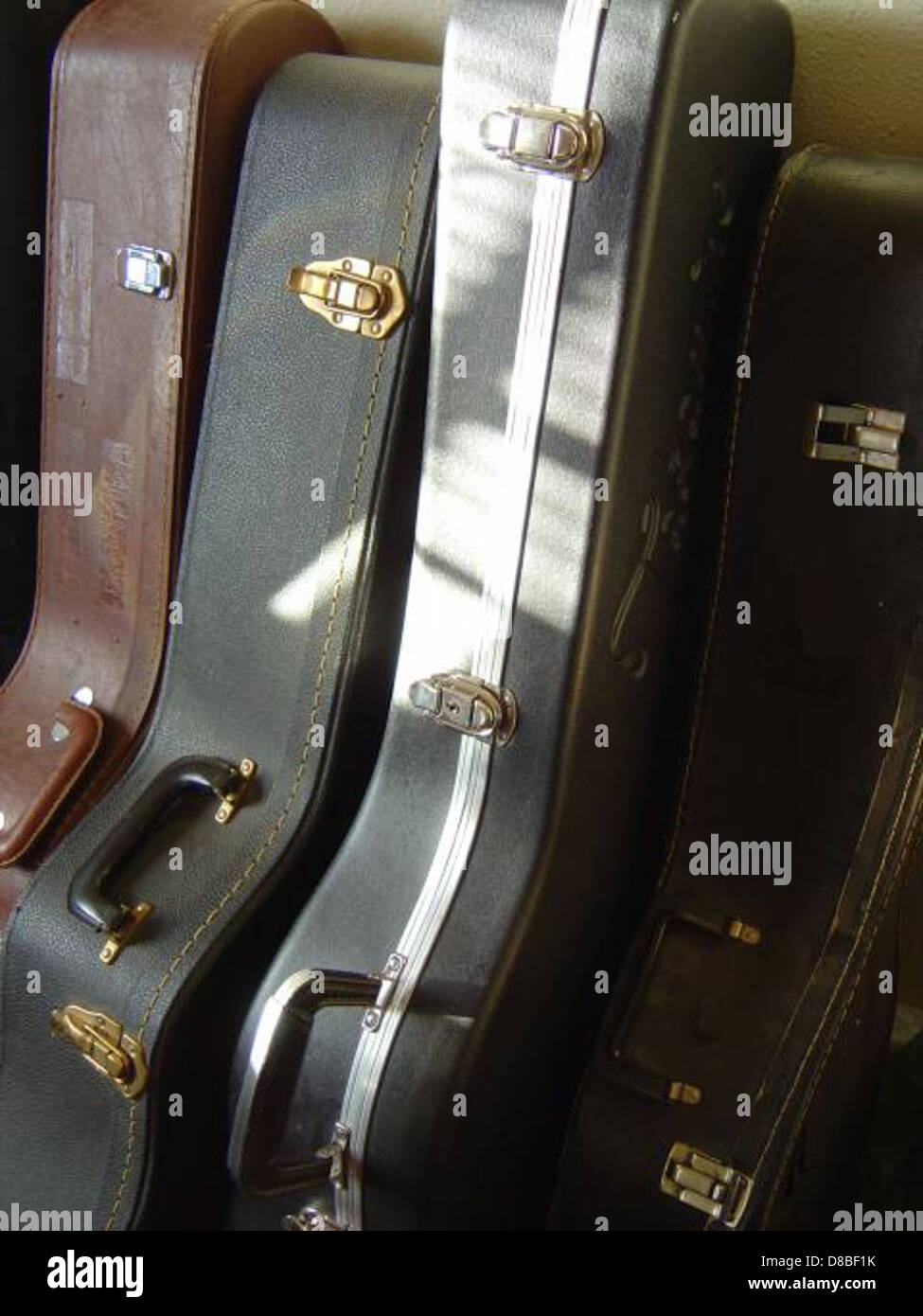 Various guitar cases are displayed, showcasing different types of ...