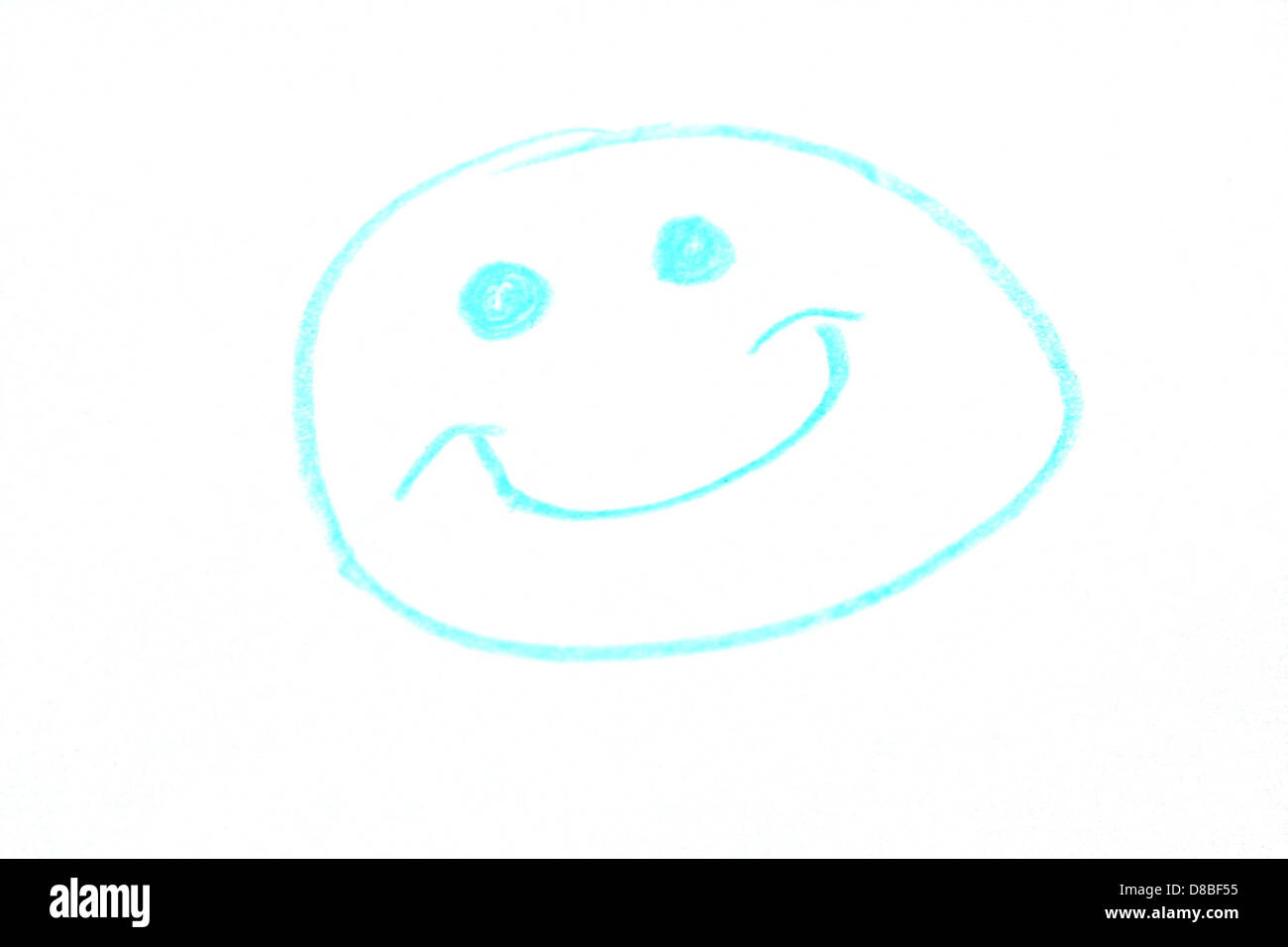 This image depicts a hand-drawn smiley face created with crayons. The ...