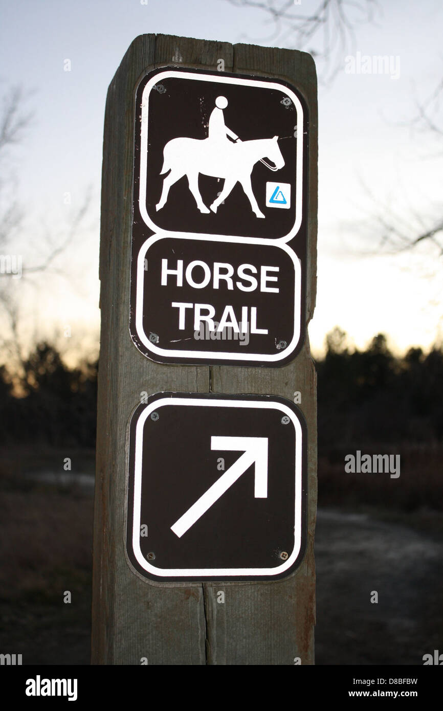 A sign indicating the presence of a horse trail, commonly seen in rural ...