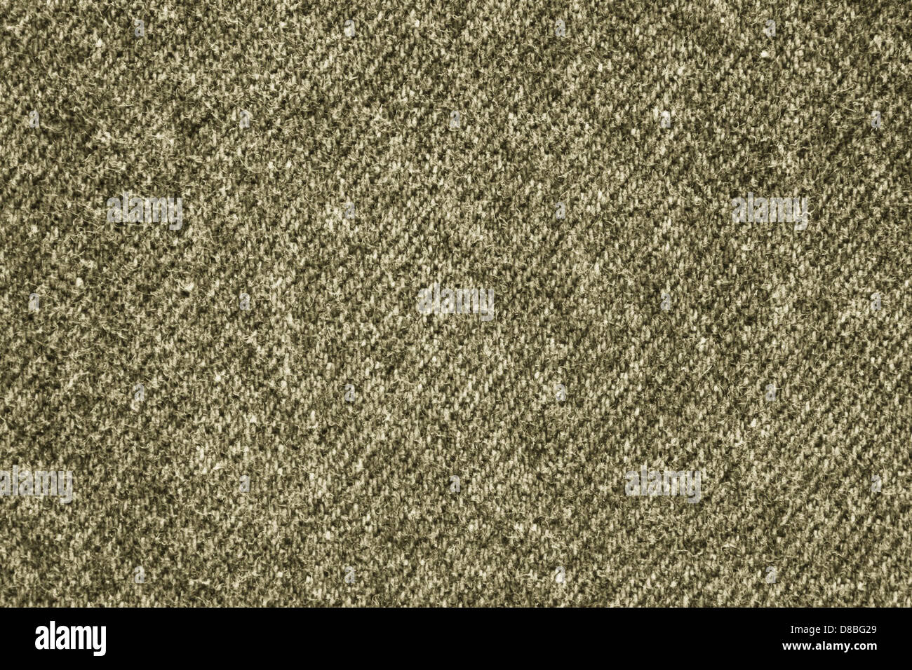 A close-up of khaki denim fabric, showcasing its textured weave ...