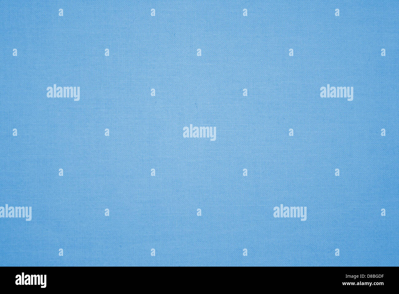 A close-up image of light blue canvas fabric, displaying its woven ...