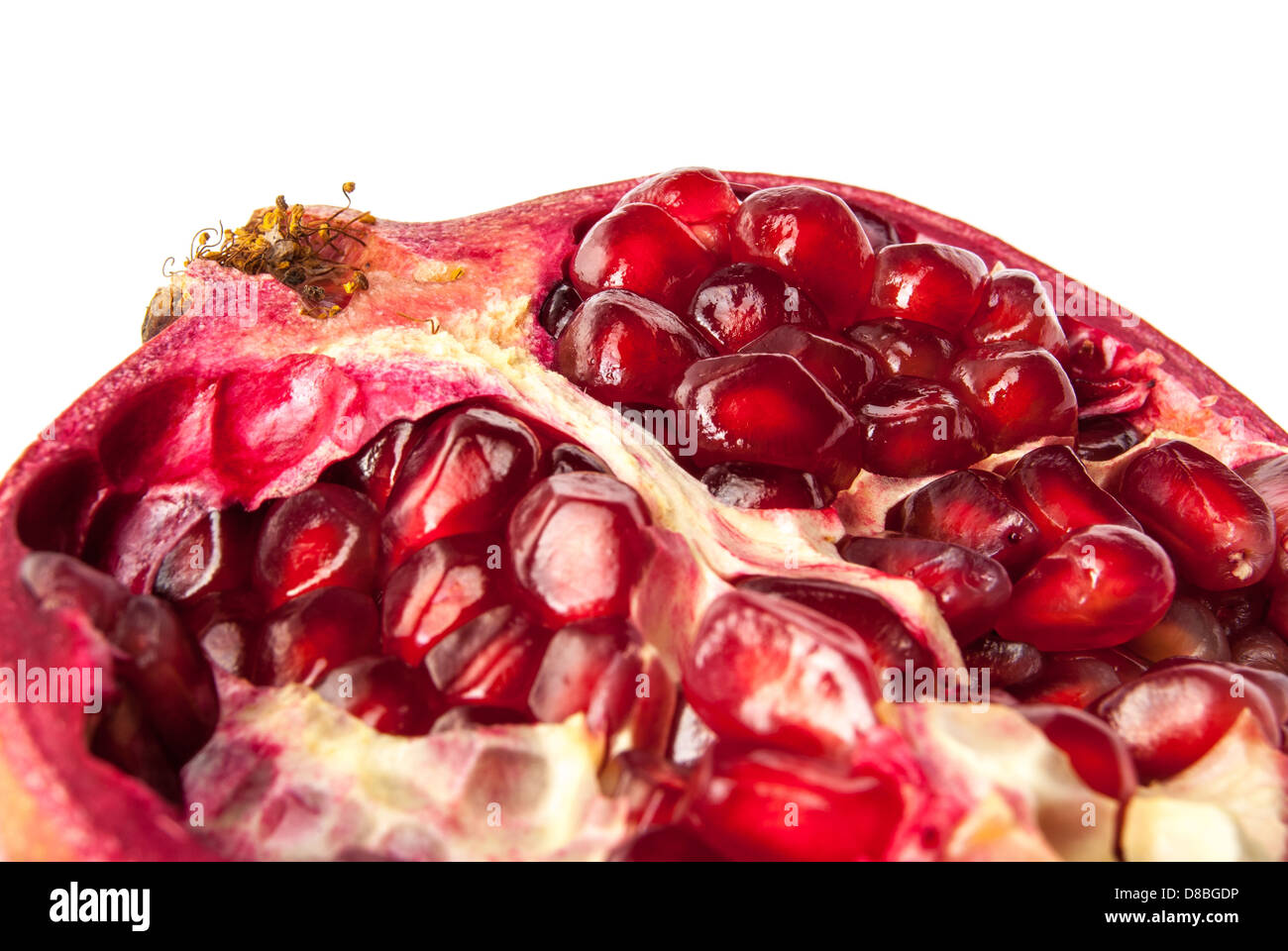 Open pomegranate on a white background, macro Stock Photo - Alamy