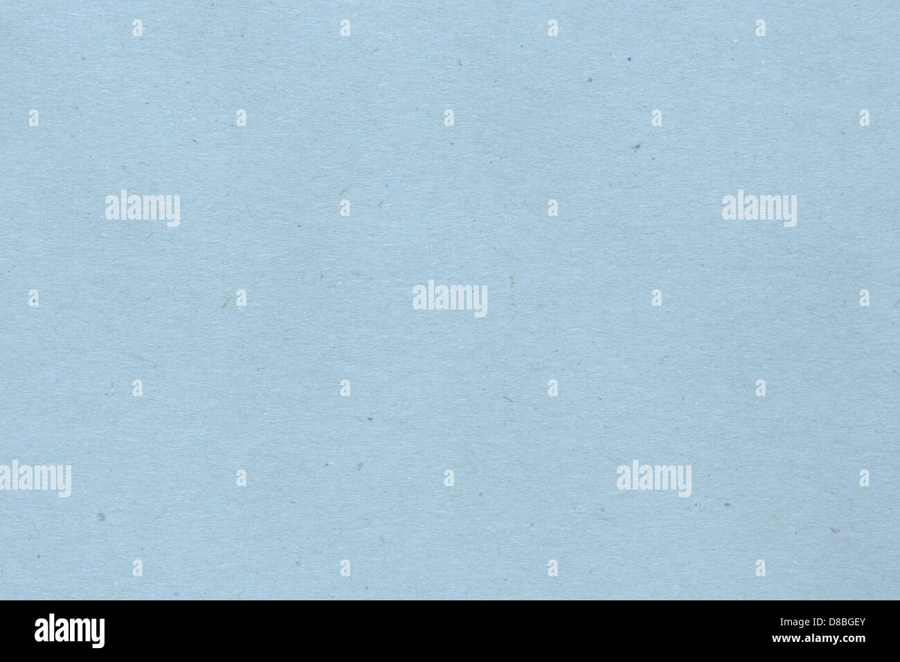 A textured light blue paper surface with small flecks, adding a unique ...