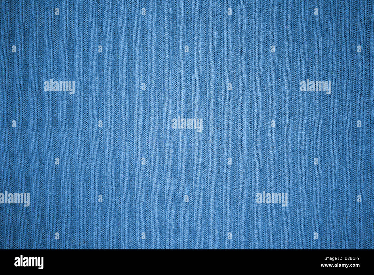 The image displays the texture of a light blue ribbed knit fabric ...