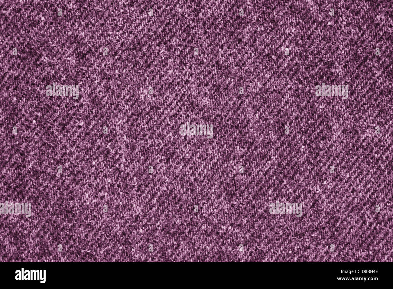 A close-up image shows the texture of mauve denim fabric. The soft ...