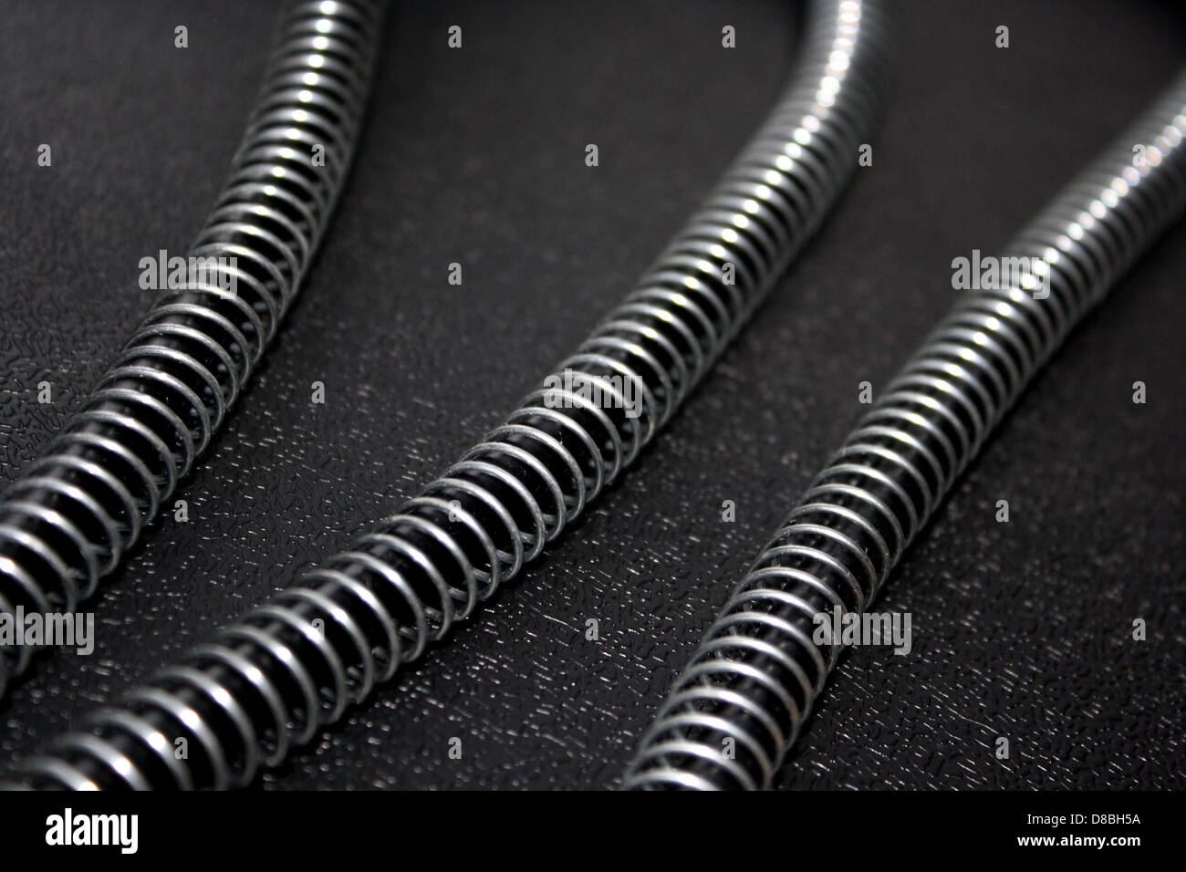 A close-up image of metal coils, showing their spiral shape and smooth ...