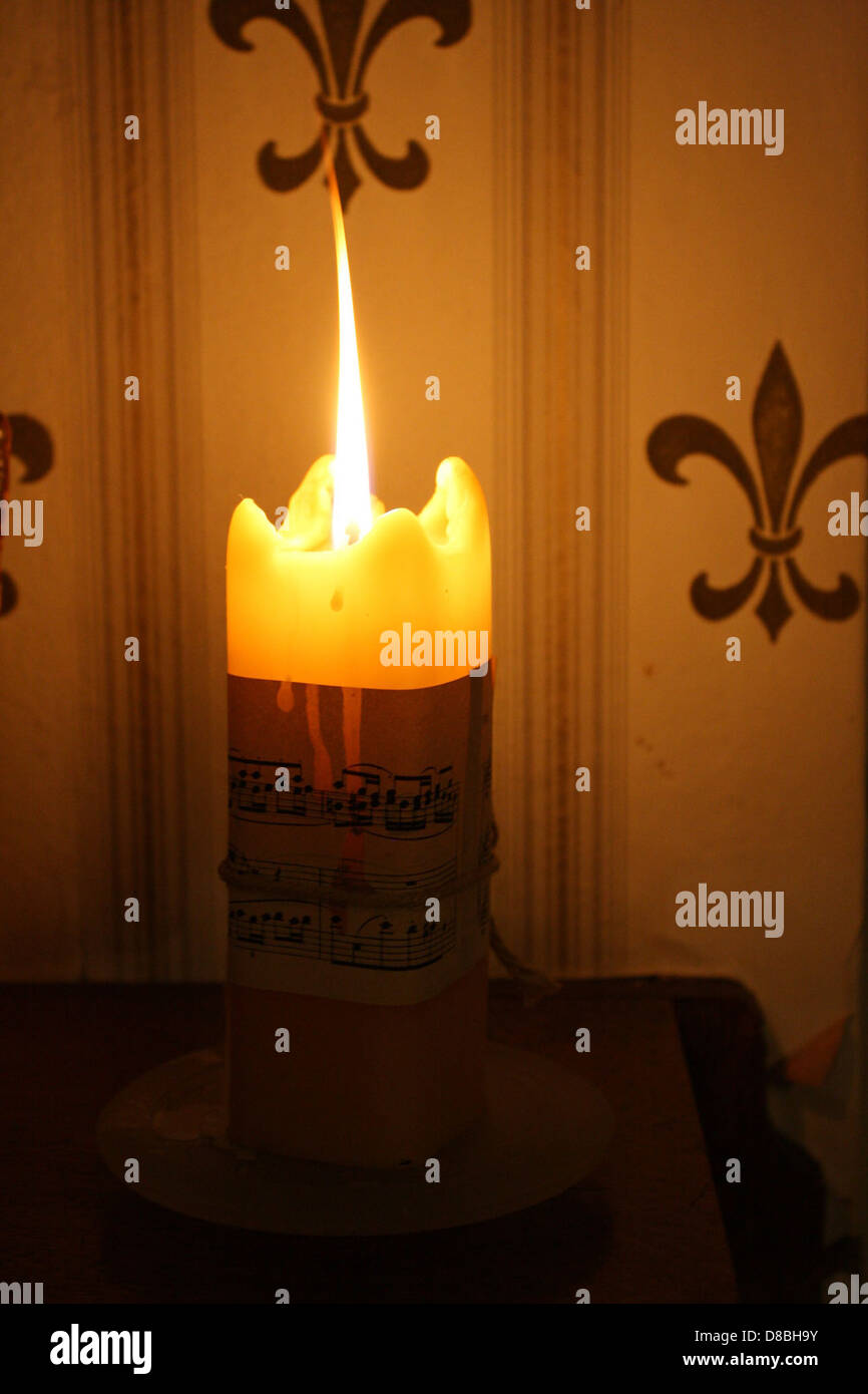 A candle shaped like musical notes, combining art and function. This ...