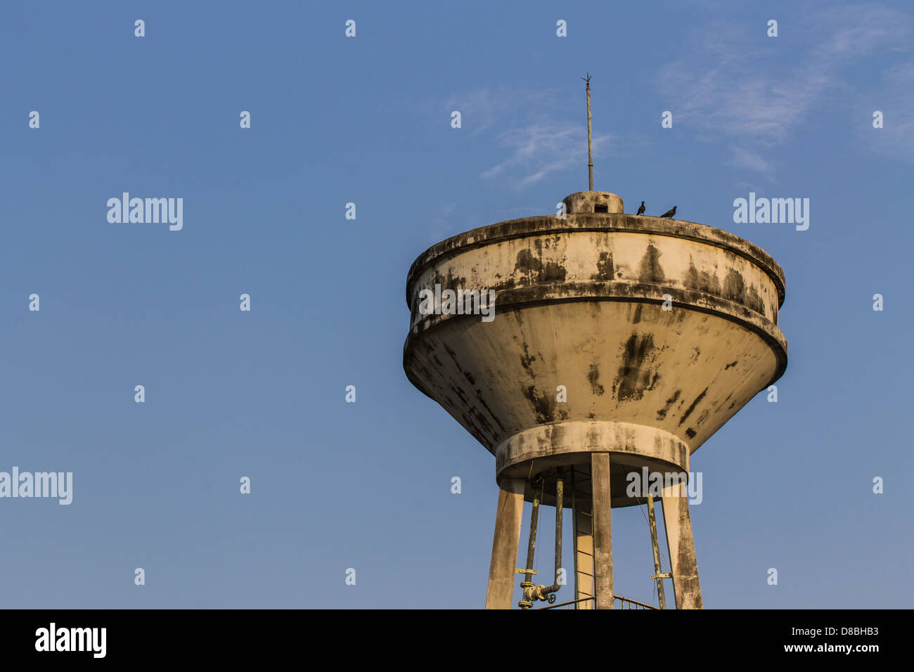 Blue sky with Thai water tank Stock Photo - Alamy
