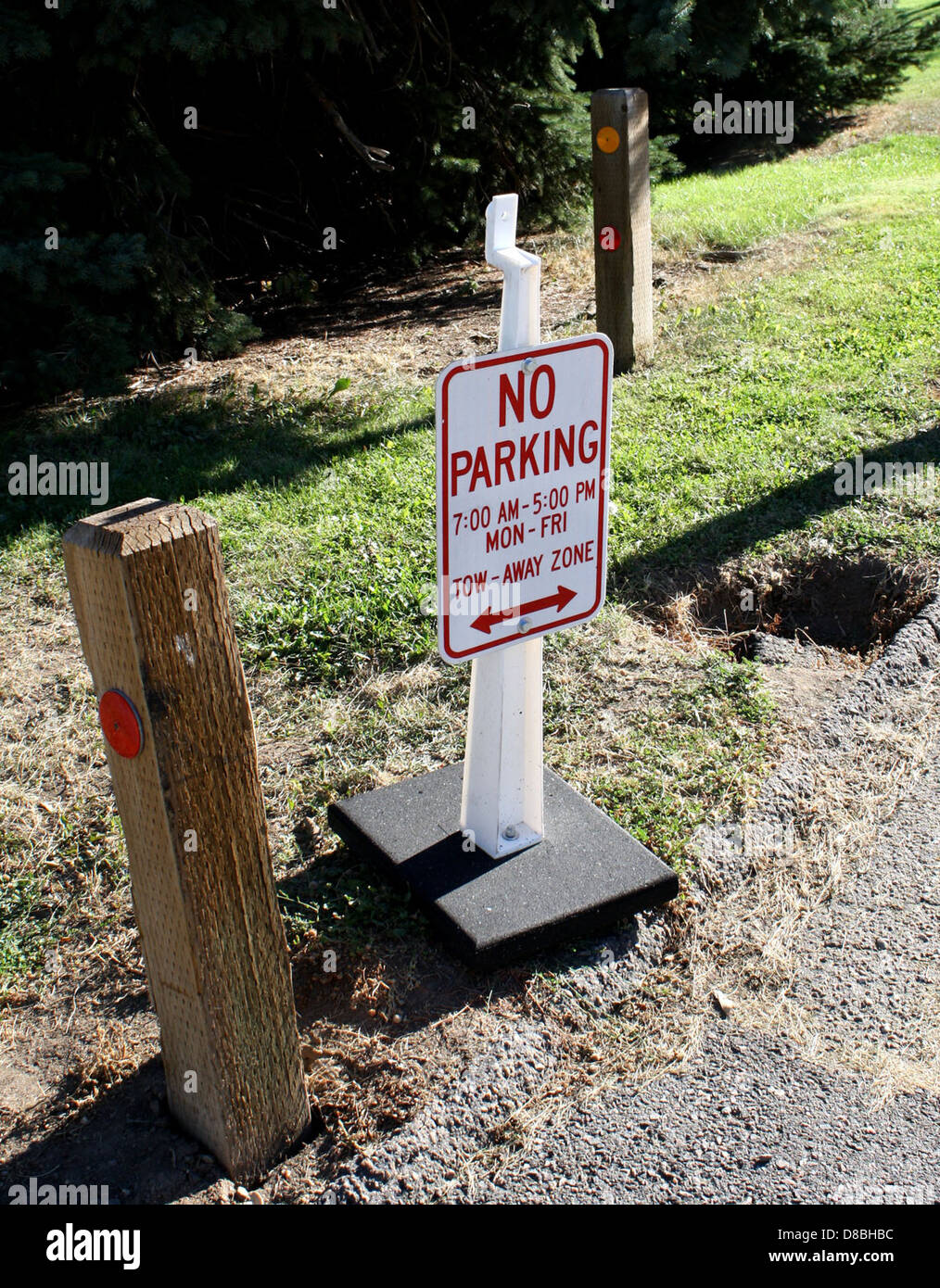 A standard no parking sign, indicating that parking is prohibited in a ...