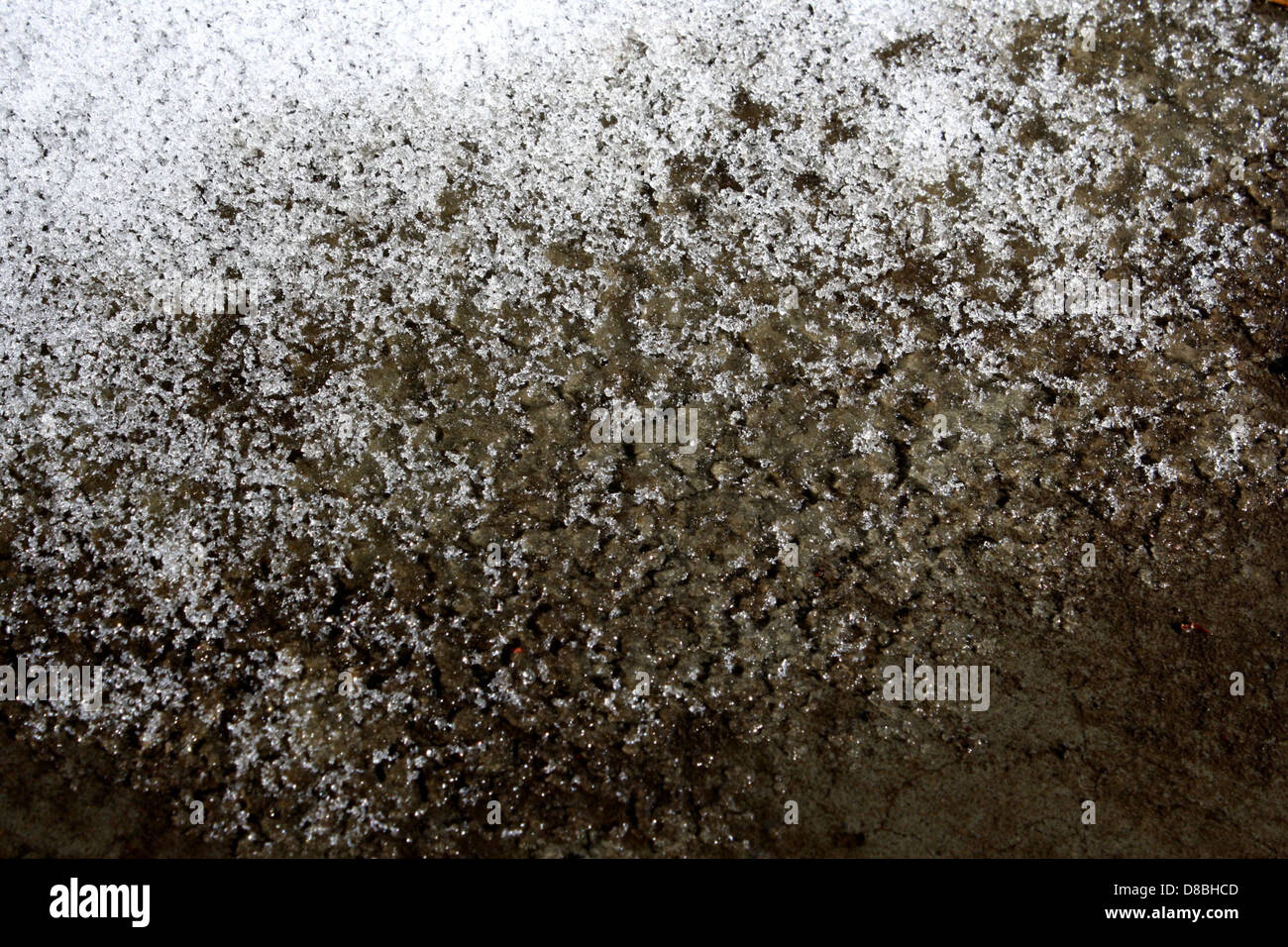 This image shows melting snow slush, a mix of snow and water, often ...