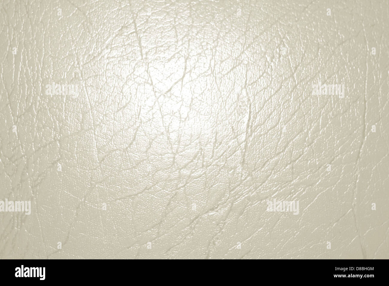 A close-up of off-white leather, highlighting its smooth texture and ...