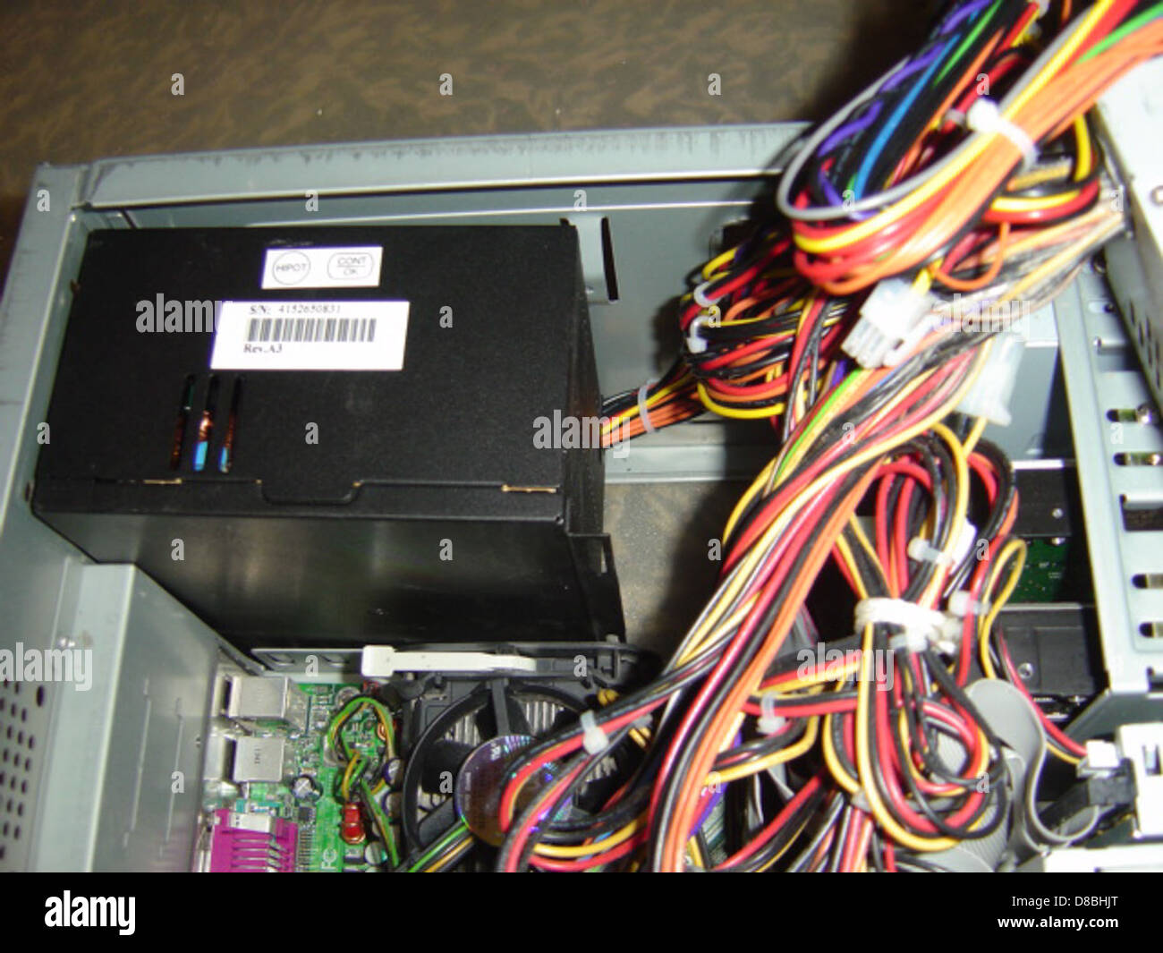 An open computer case revealing the internal components, including the ...