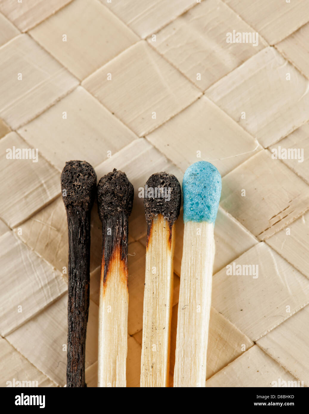 Close up of four matches, three burned Stock Photo - Alamy