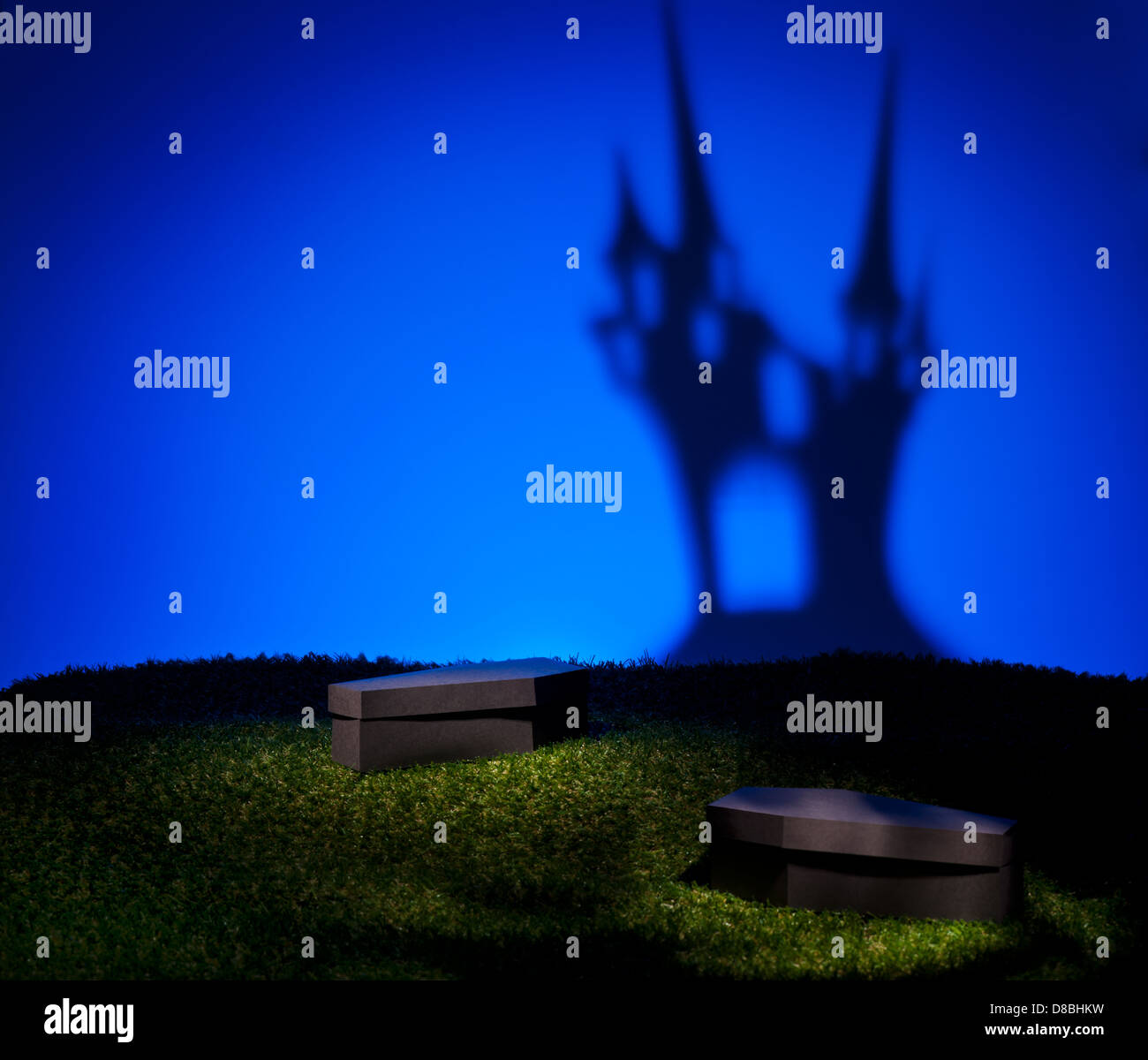 The castle and the graveyard with two coffins Stock Photo - Alamy