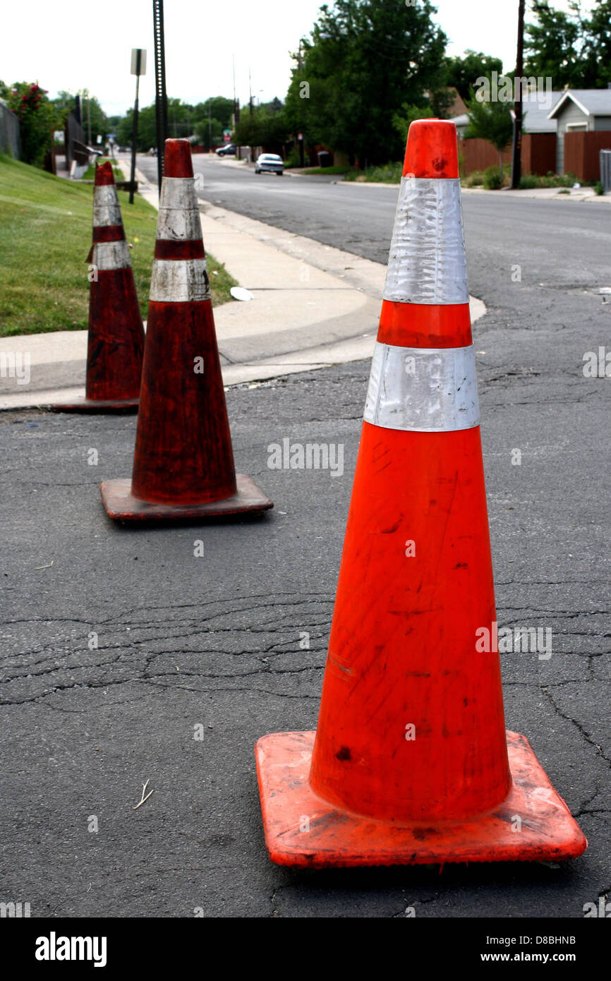 Orange traffic cones are placed at an intersection to block traffic ...