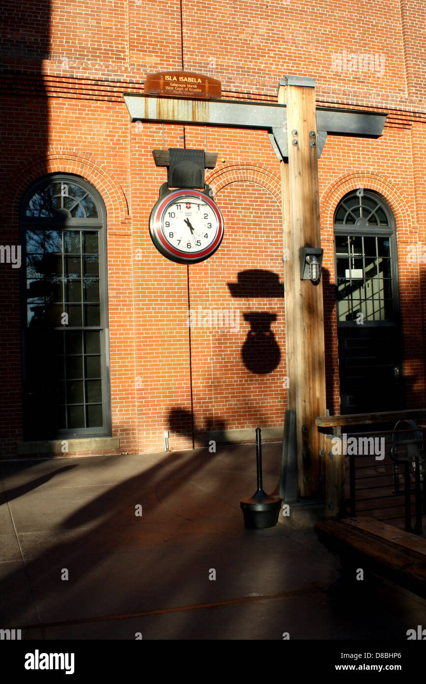 outdoor rustic hanging clock Stock Photo - Alamy