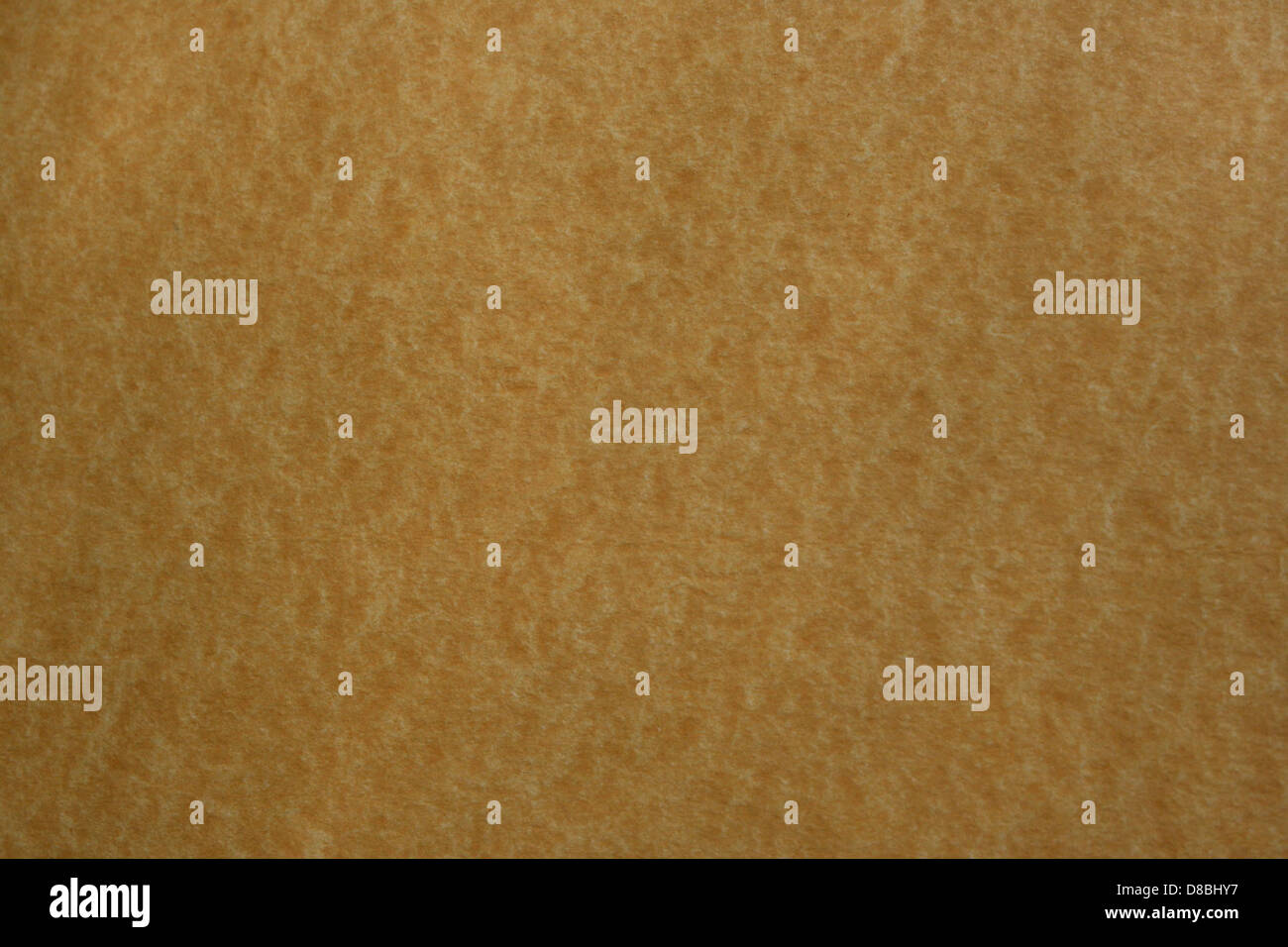 A close-up of a textured parchment paper with subtle wrinkles and an ...