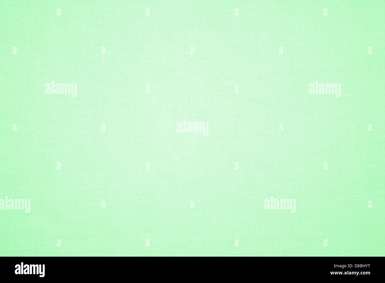 A close-up image showing the texture of pastel green canvas fabric ...