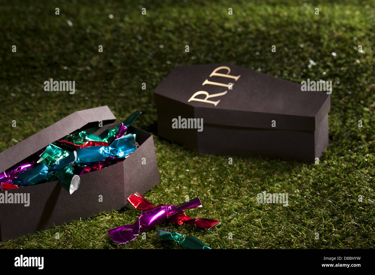 Halloween coffin on lawn with sweets and candies Stock Photo - Alamy