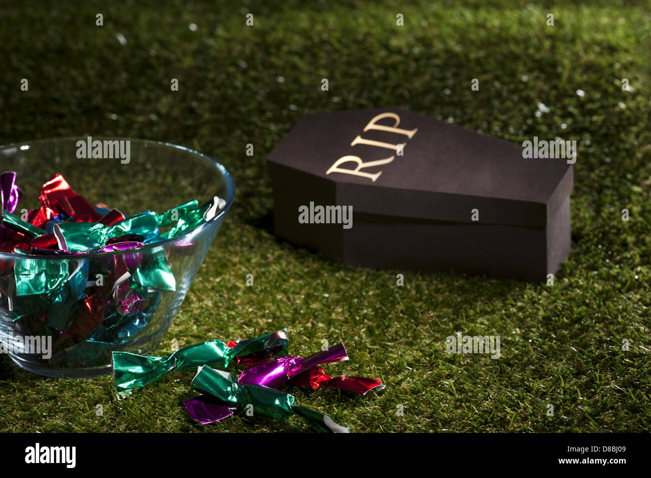 Halloween coffin on lawn with sweets and candies Stock Photo - Alamy