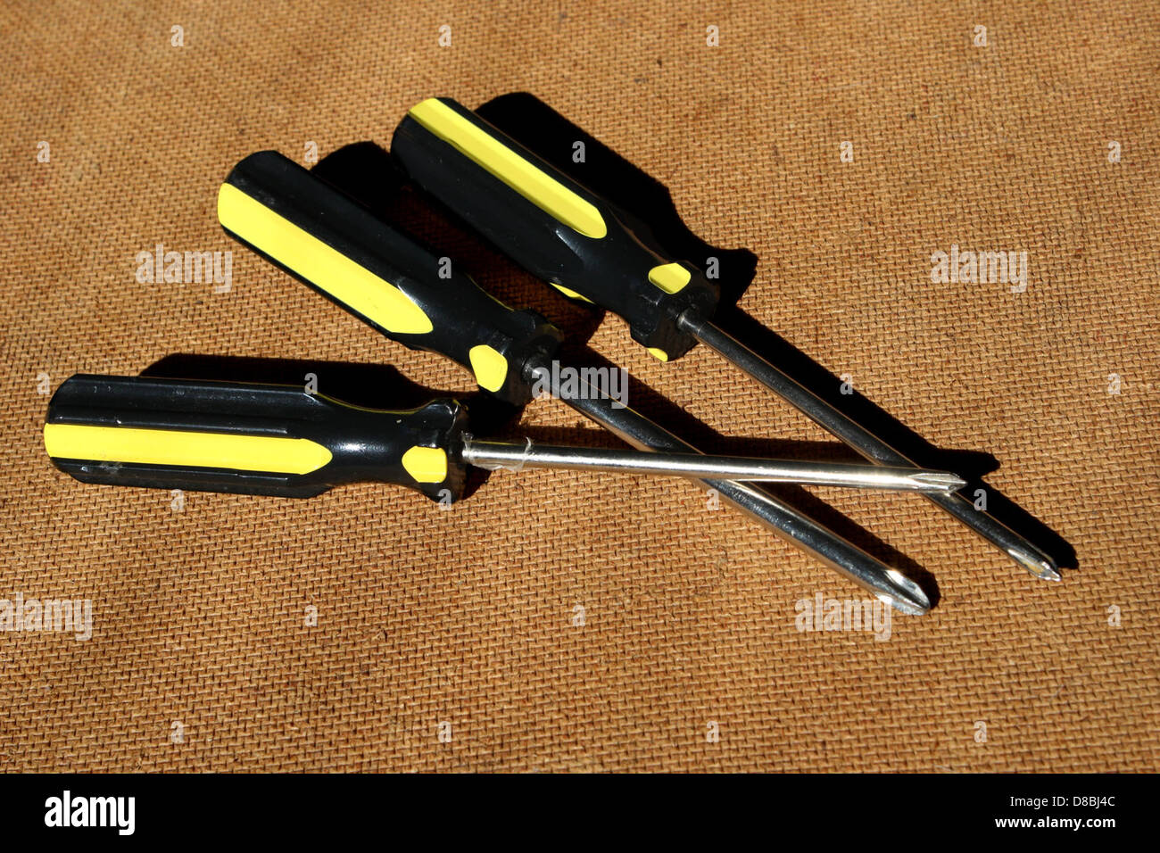 A close-up image of several Phillips head screwdrivers, known for their ...