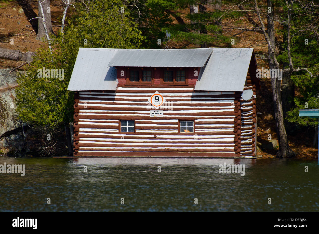 Old log boathouse Stock Photo - Alamy