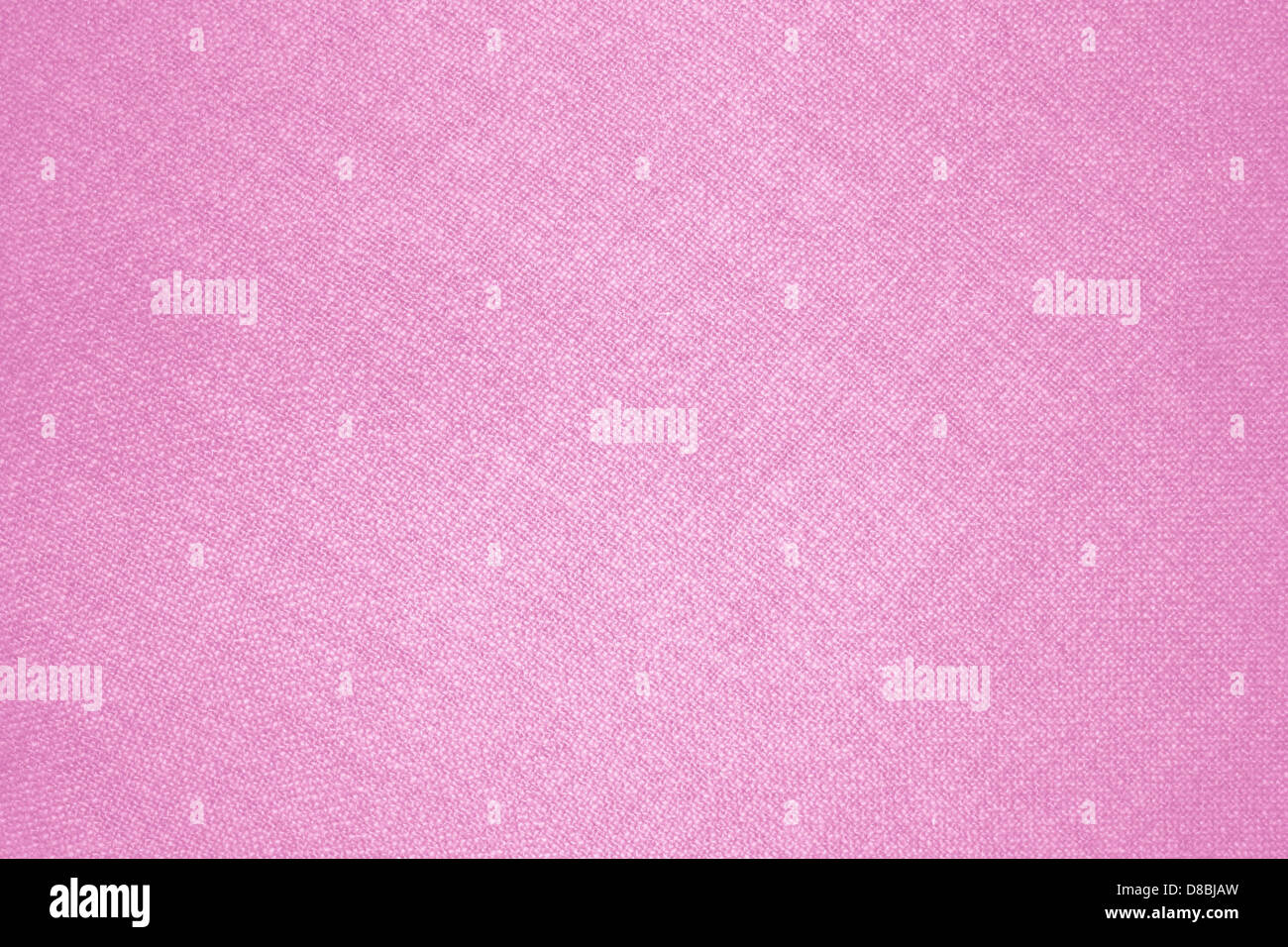 A close-up image of a soft pink fabric texture, showing the fine weave ...
