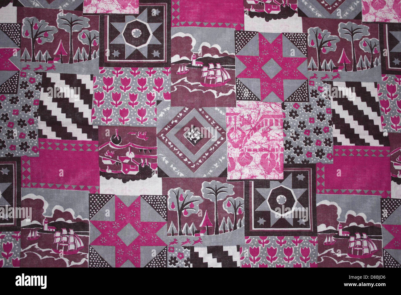 A close-up image of a pink patchwork quilt, showing the fabric's ...