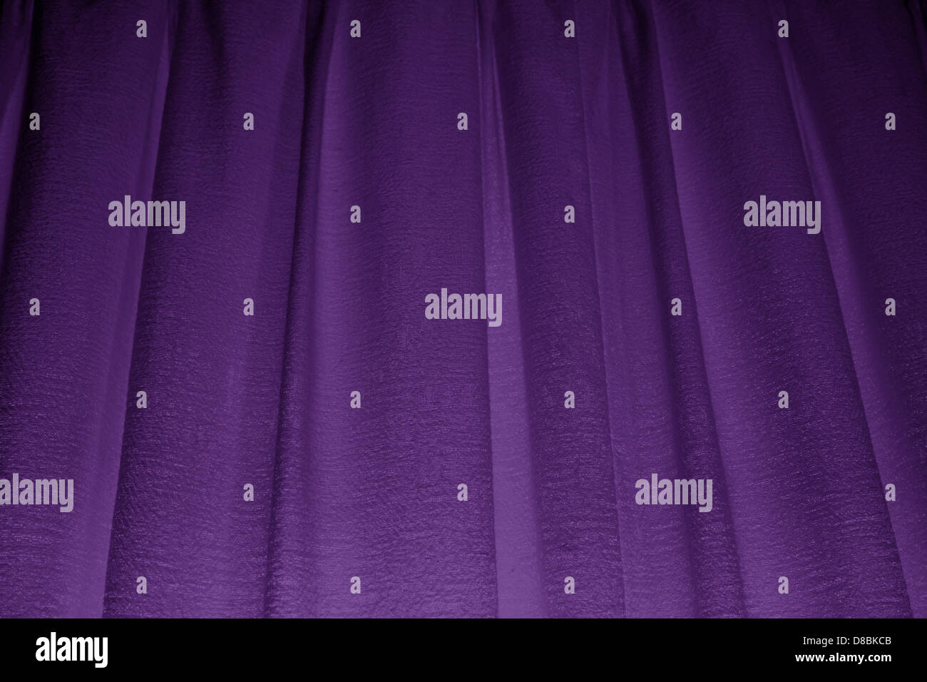 A close-up of purple curtains, showcasing the rich texture and smooth ...