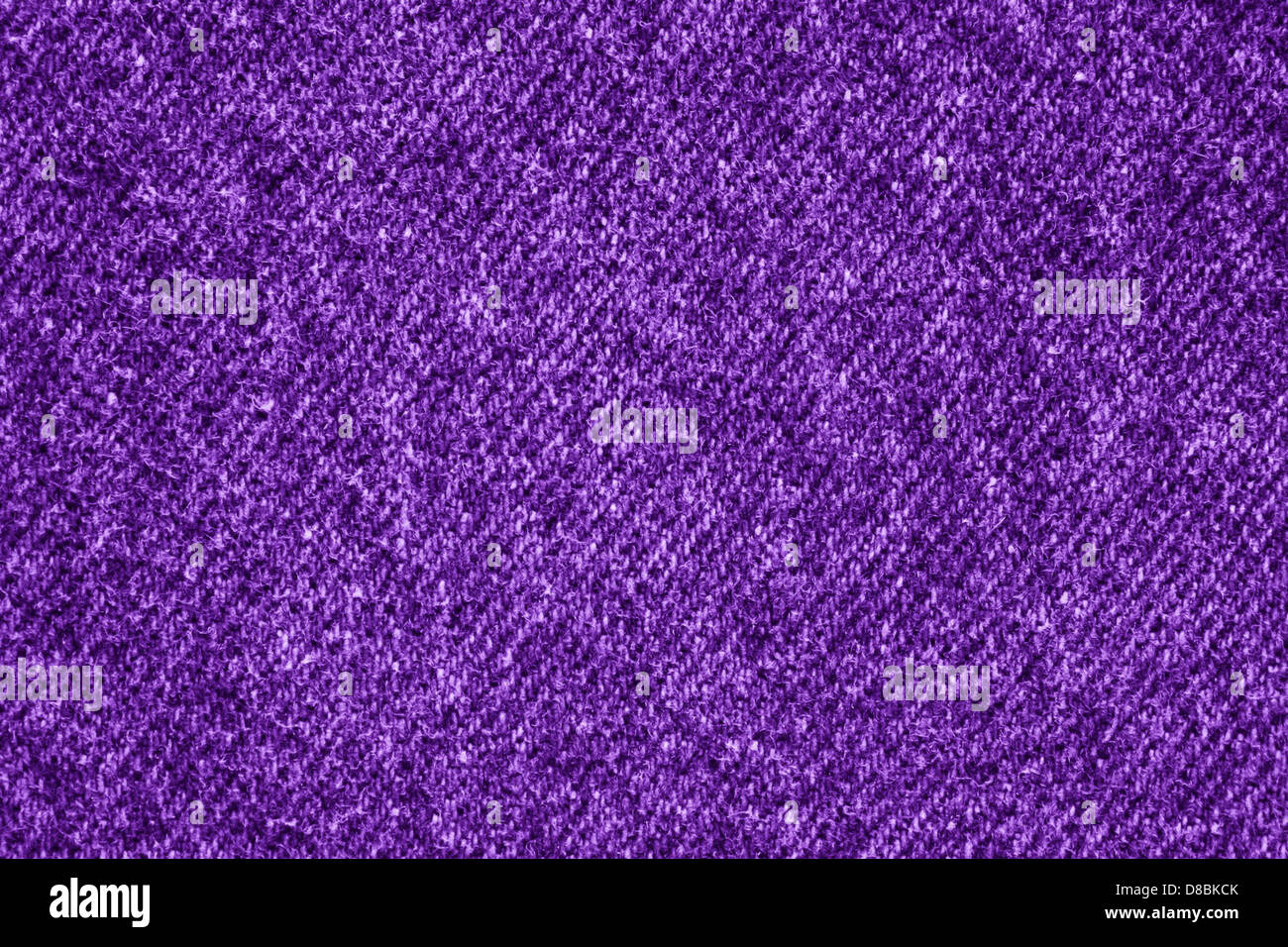 This image features a close-up of purple denim fabric, showcasing its ...