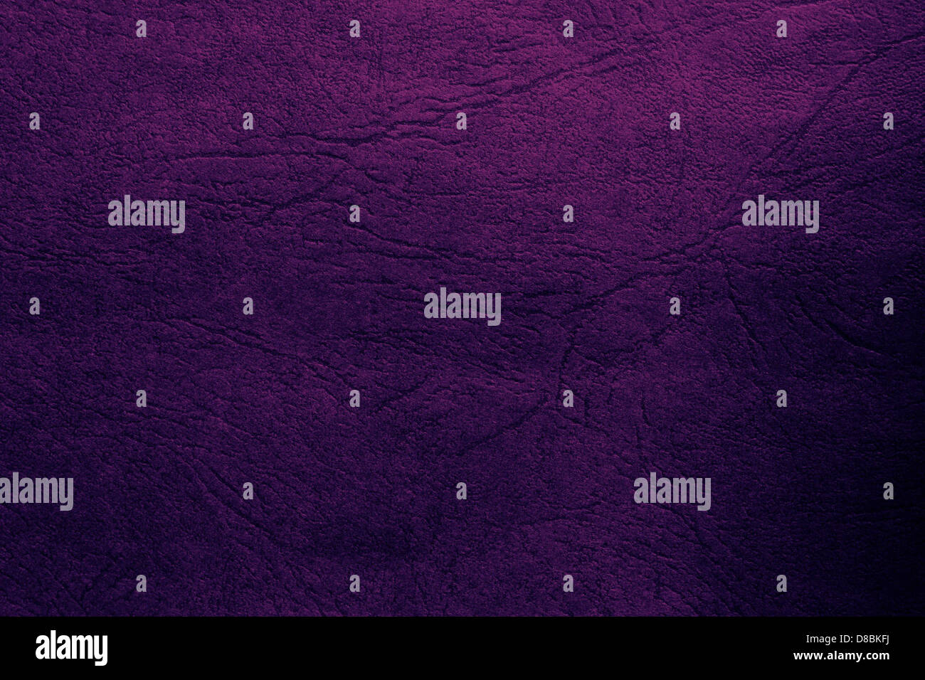 The smooth, rich texture of purple leather is showcased, highlighting ...