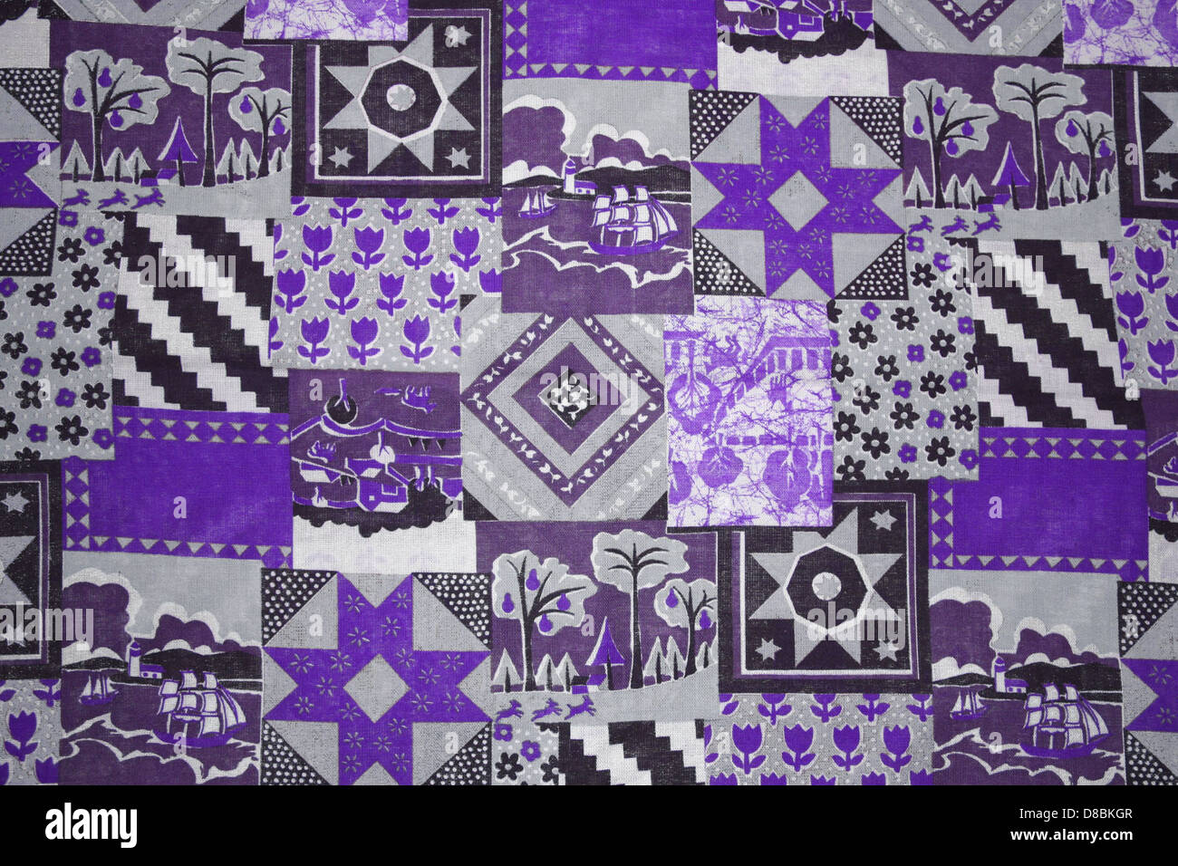 A close-up shot of purple patchwork quilt fabric, showcasing a variety ...