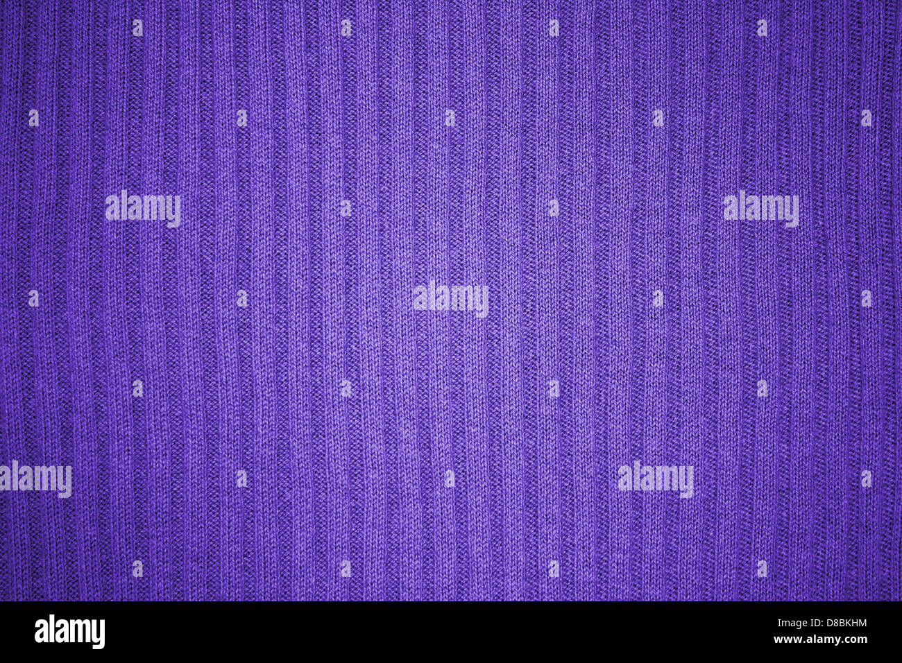 A close-up image of a purple ribbed knit texture, showcasing the ...