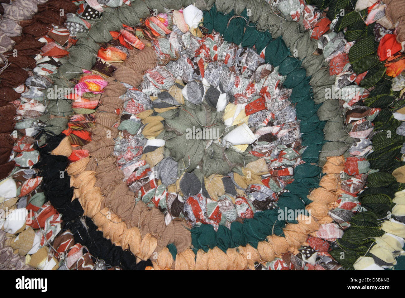 A close-up image showing the intricate texture of a rag rug. The woven ...
