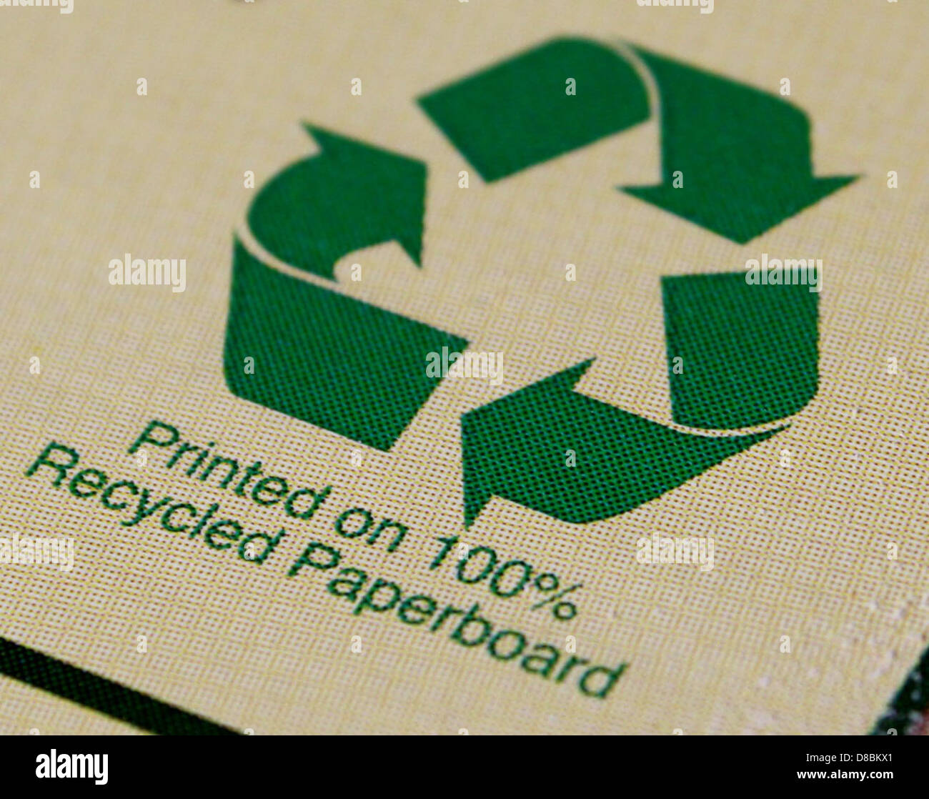 A cardboard box with visible recycling arrows symbol, indicating that ...