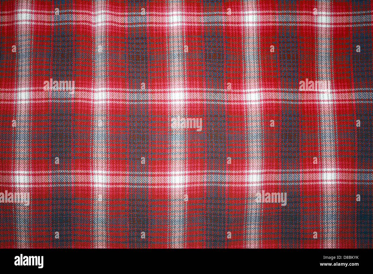 This image presents a fabric texture with a red and blue plaid pattern ...