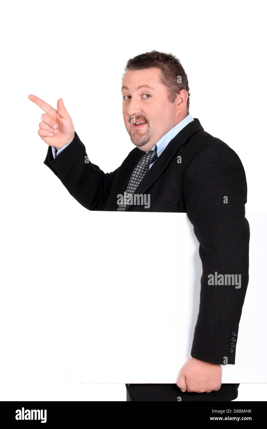 Chubby businessman pointing Stock Photo - Alamy