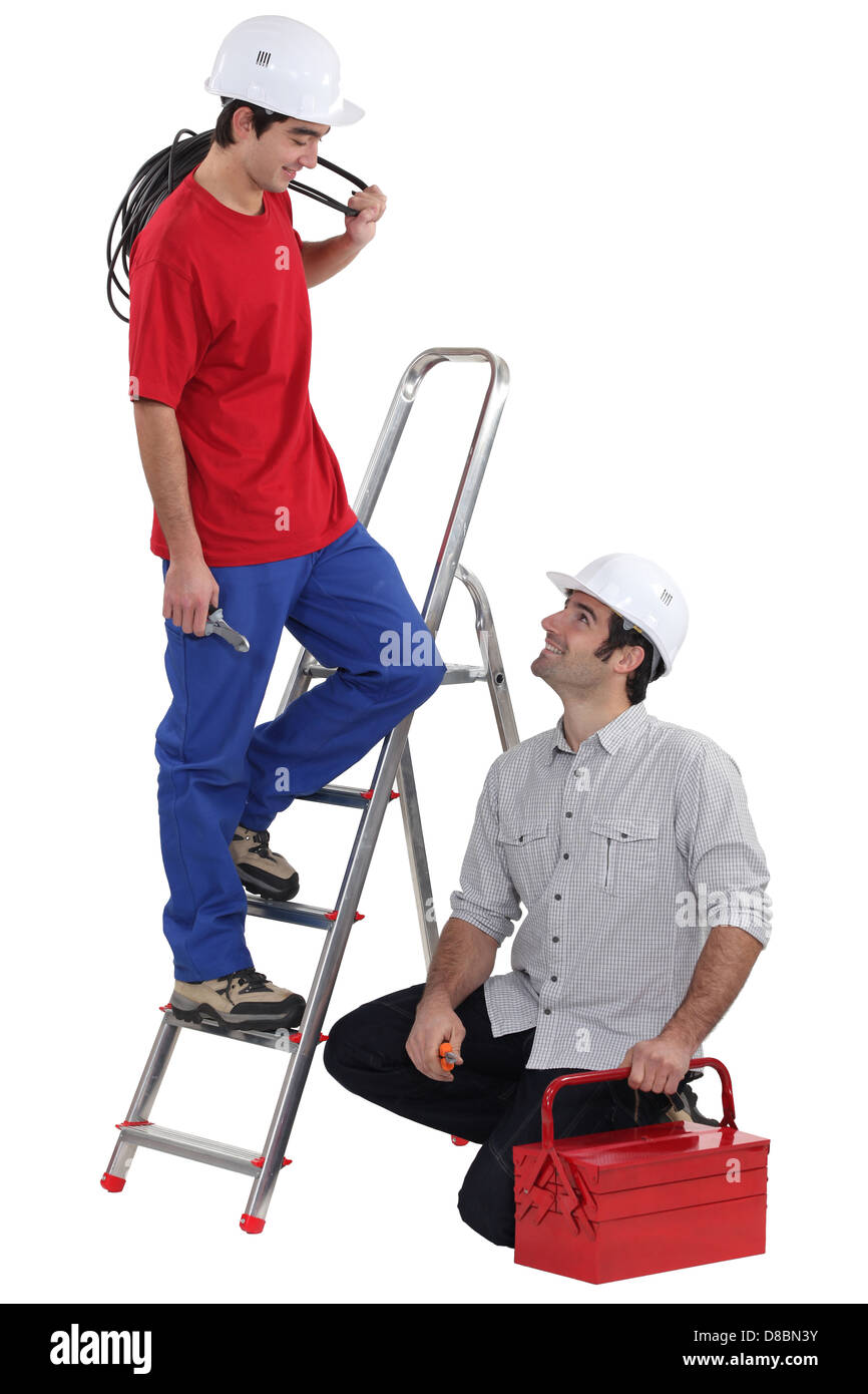 Team of electricians on white background Stock Photo - Alamy