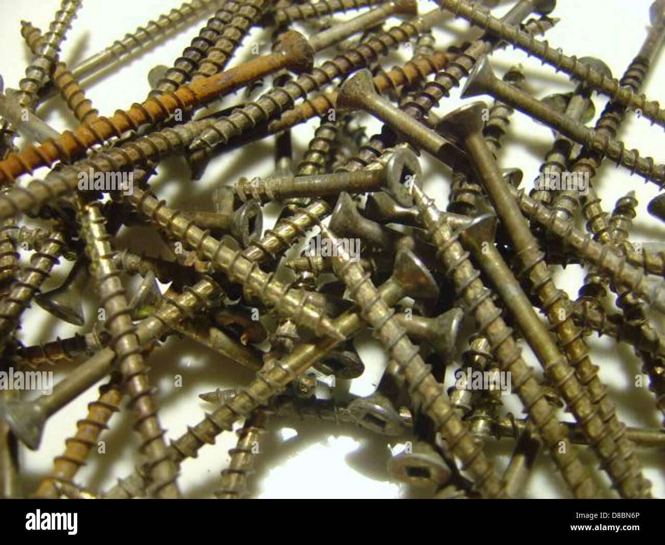 Various screws of different sizes and types, used in construction and ...