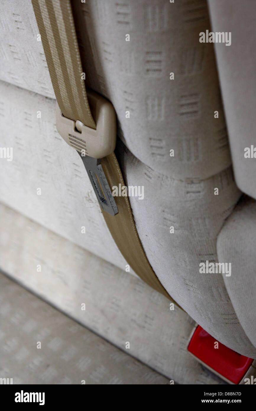 A close-up image of a seat belt in a vehicle, showcasing its design and ...