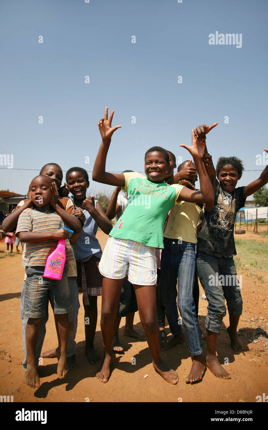 Portrait of smiling African children playing on the dirt road Stock ...