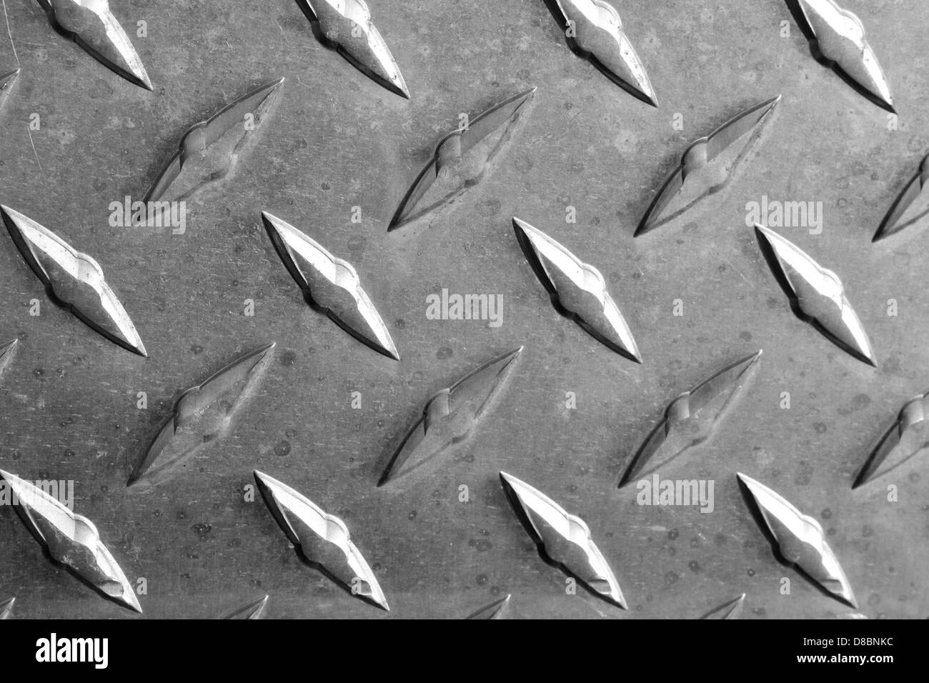 A close-up image of textured silver metal, highlighting the intricate ...