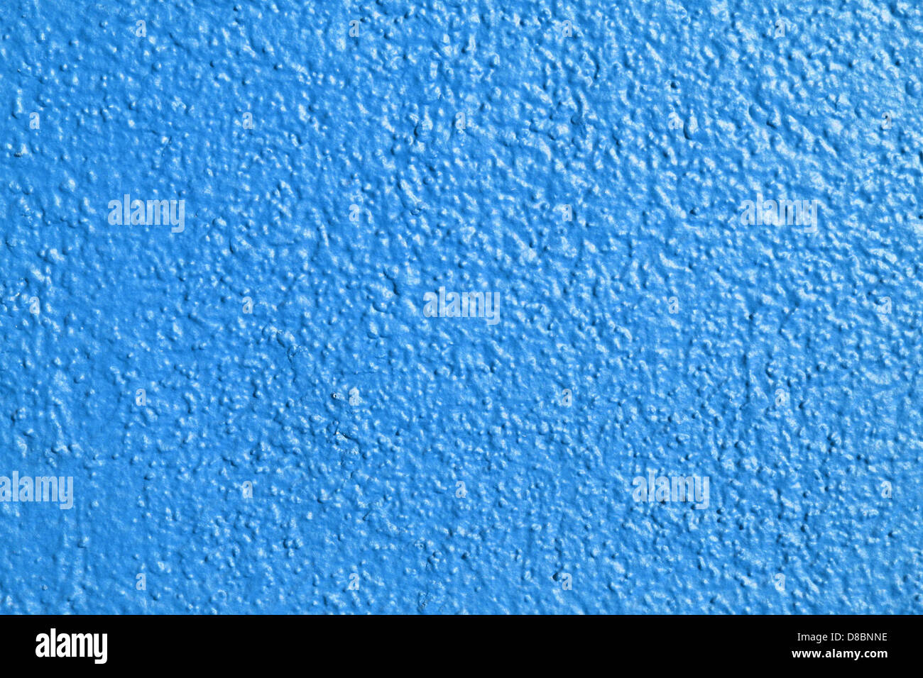 A textured sky blue painted wall with subtle variations in color ...